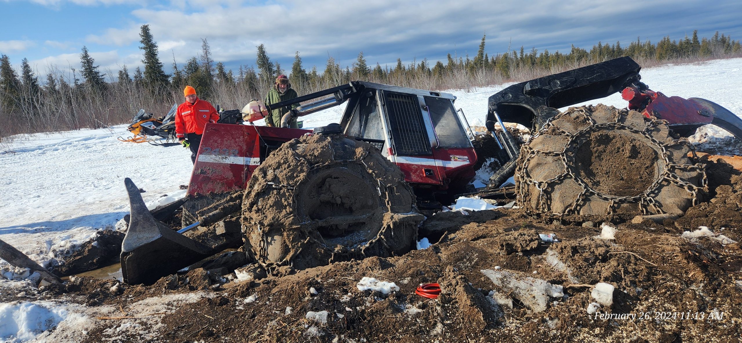 Workers race to get logging truck off frozen Maine lake before ice melts