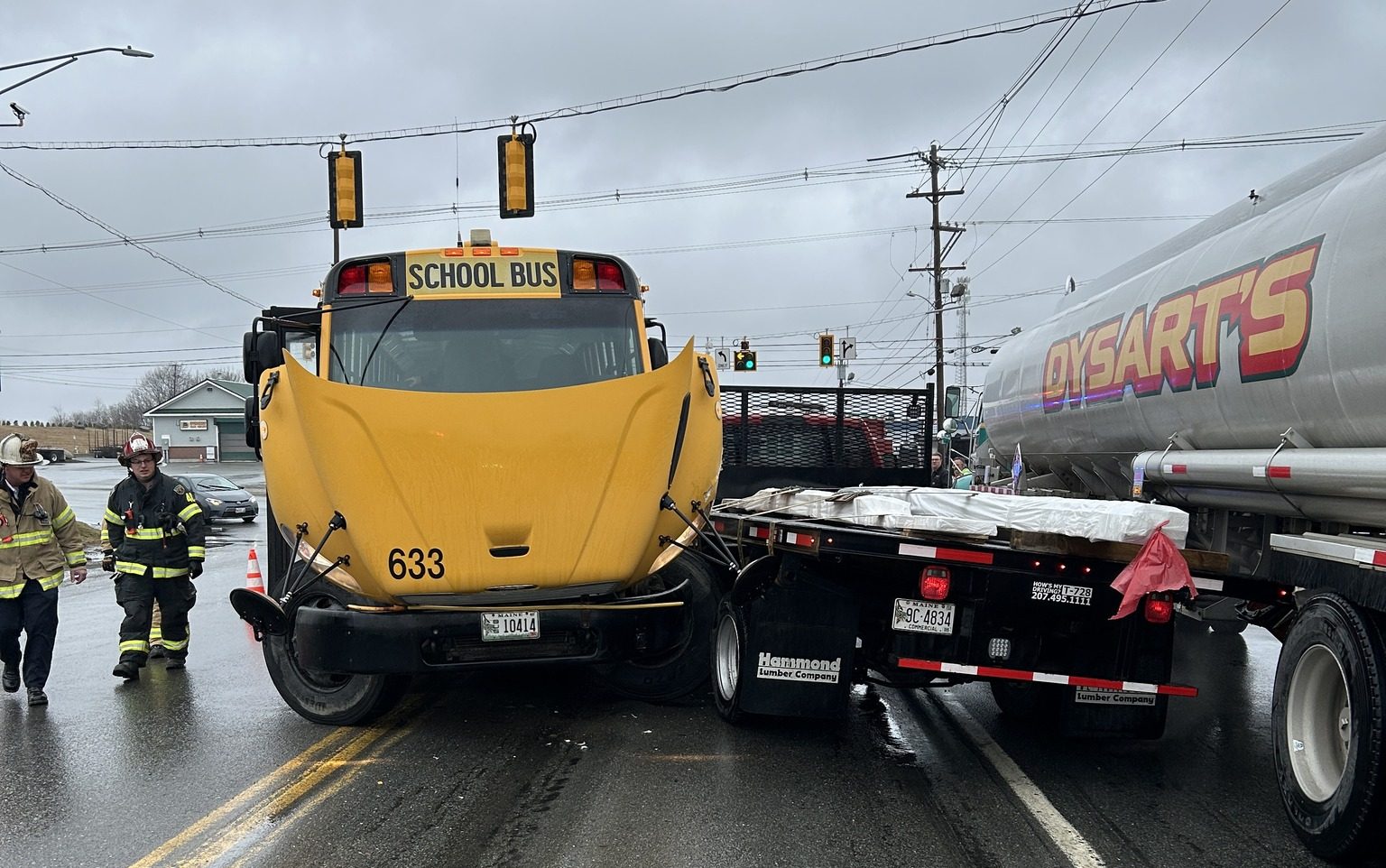 School bus causes chain-reaction crash with lumber and fuel trucks in Hermon